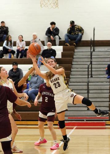 Stonington junior forward Katelyn Cadmus (23) puts up a shot during the ...