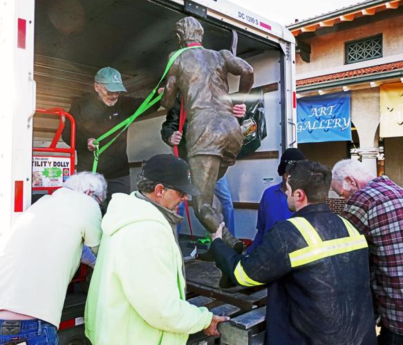 Bronze statue of running legend Tarzan Brown arrives safely to its ...