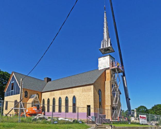 PHOTOS: Rebuilding of St. Michael Church hits milestone with placing of ...