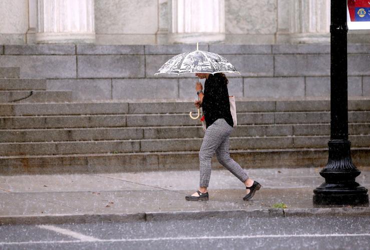 PHOTOS: People getting drenched in torrential rain | Westerly ...