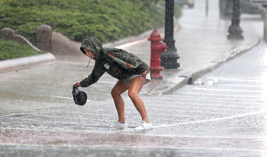 PHOTOS: People getting drenched in torrential rain | Westerly ...