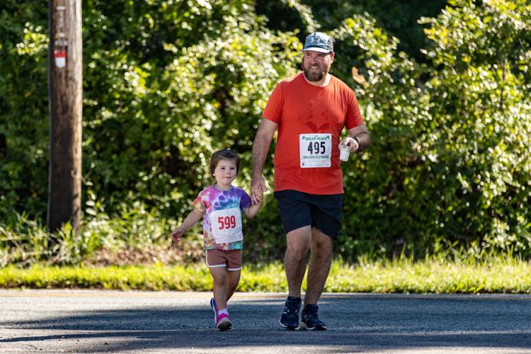 Running: Hayes, Zichichi win their divisions at Run the Village 5K ...