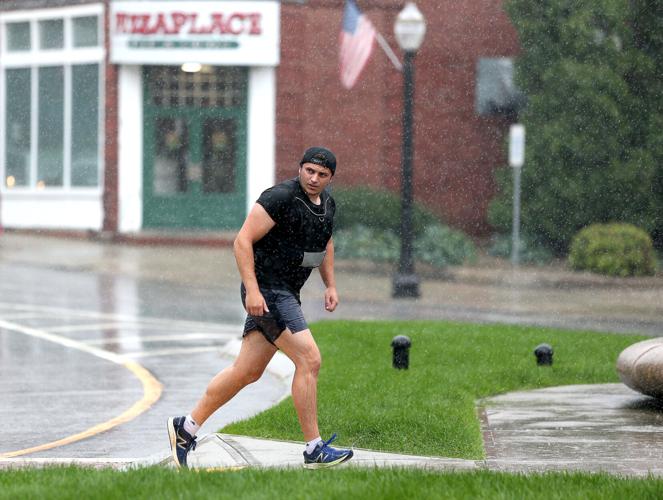 PHOTOS: People getting drenched in torrential rain | Westerly ...