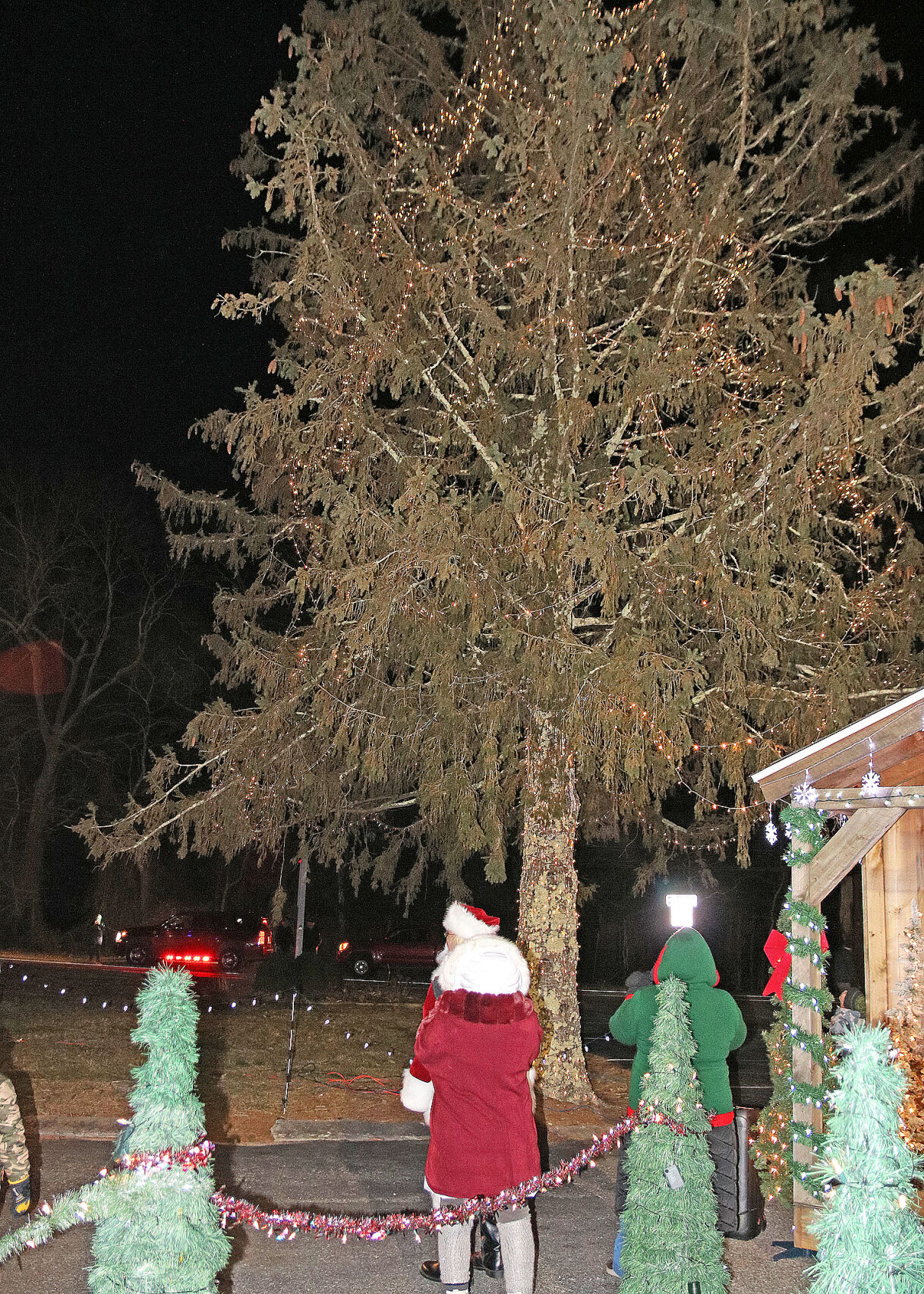 Mr. and Mrs. Claus share the excitement with the crowd as the Christmas ...