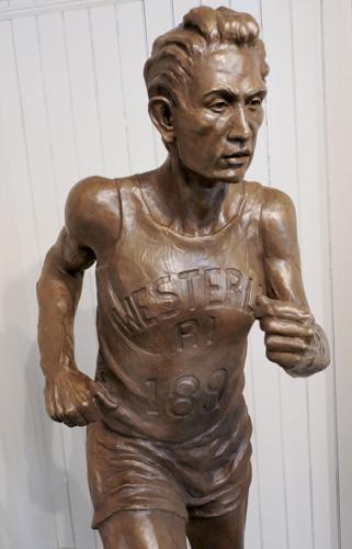 Bronze statue of running legend Tarzan Brown arrives safely to its ...