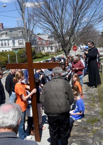 PHOTOS: St. Pius X re-enacts Stations of the Cross along Elm Street ...