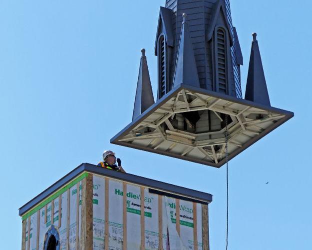PHOTOS: Rebuilding of St. Michael Church hits milestone with placing of ...