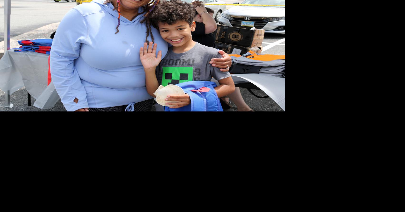 PHOTOS: Backpack giveaway at Wireless Zone in Dunn's Corners fun for ...