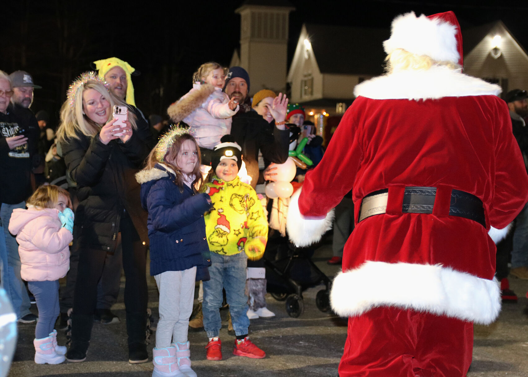 The kids happily greet Santa Claus as he arrives at the Richmond Town ...