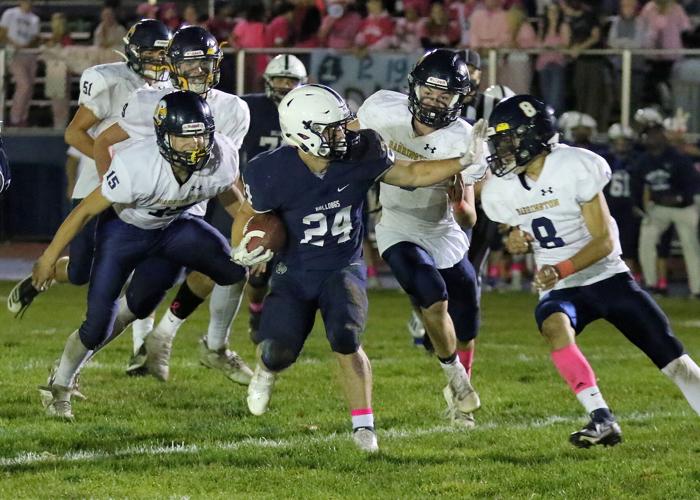Football: 'Perfect night' — Tuck rushes for 230 yards, 3 TDs as ...