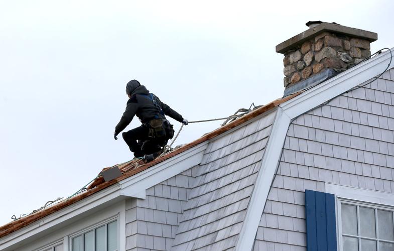 PHOTOS: Precarious perch on a roofing job | Westerly | thewesterlysun.com