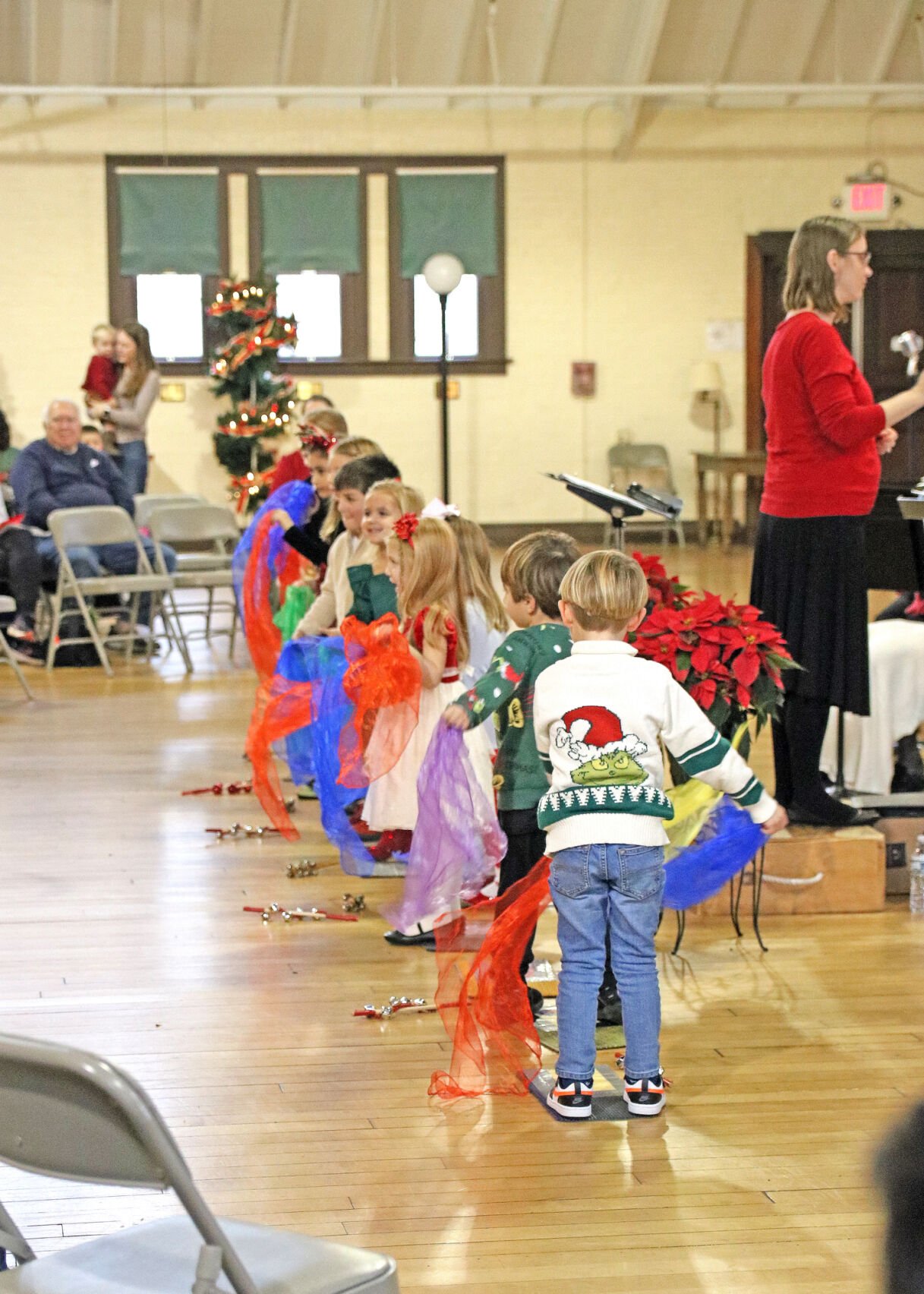 The kids get ready to wave brightly colored sashes at the Westerly Band ...