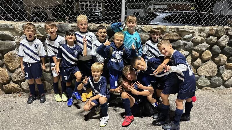 Members of the Westerly Boys U-9 Soccer Team play during half time ...