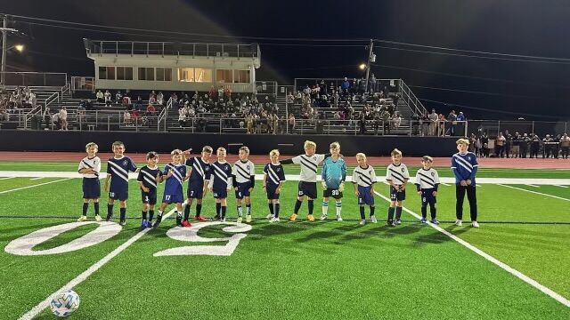 Members of the Westerly Boys U-9 Soccer Team play during half time ...