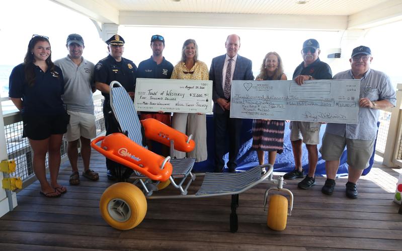 PHOTOS: Vuono Charity Fund gifts flotation chairs to town beach ...