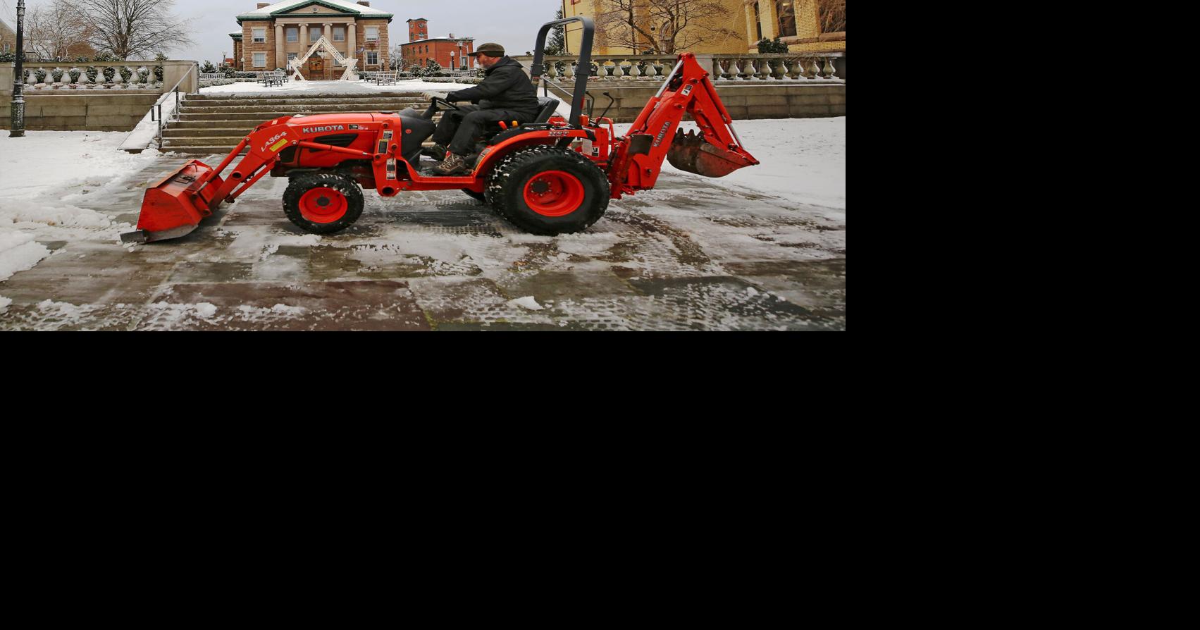 Alan Peck, Wilcox Park and Westerly Library Superintendent, clears the ...