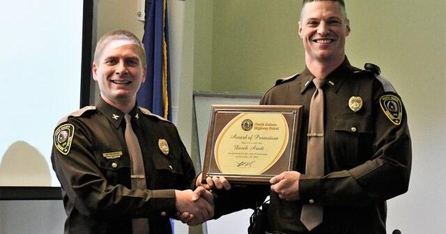 Colonel Brandon Solberg announces the promotion of Sgt. Derek Arndt to ...