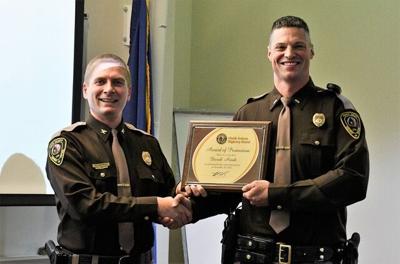 Colonel Brandon Solberg announces the promotion of Sgt. Derek Arndt to ...