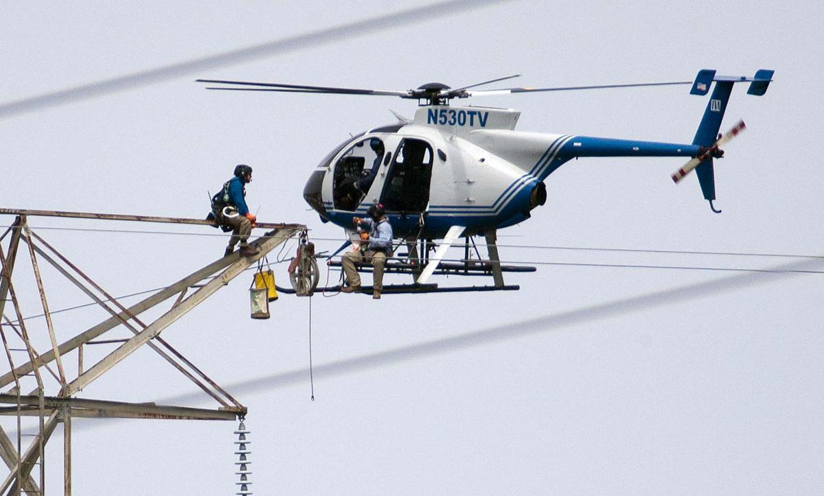 TVA uses helicopters to string powers across the Tennessee River ...