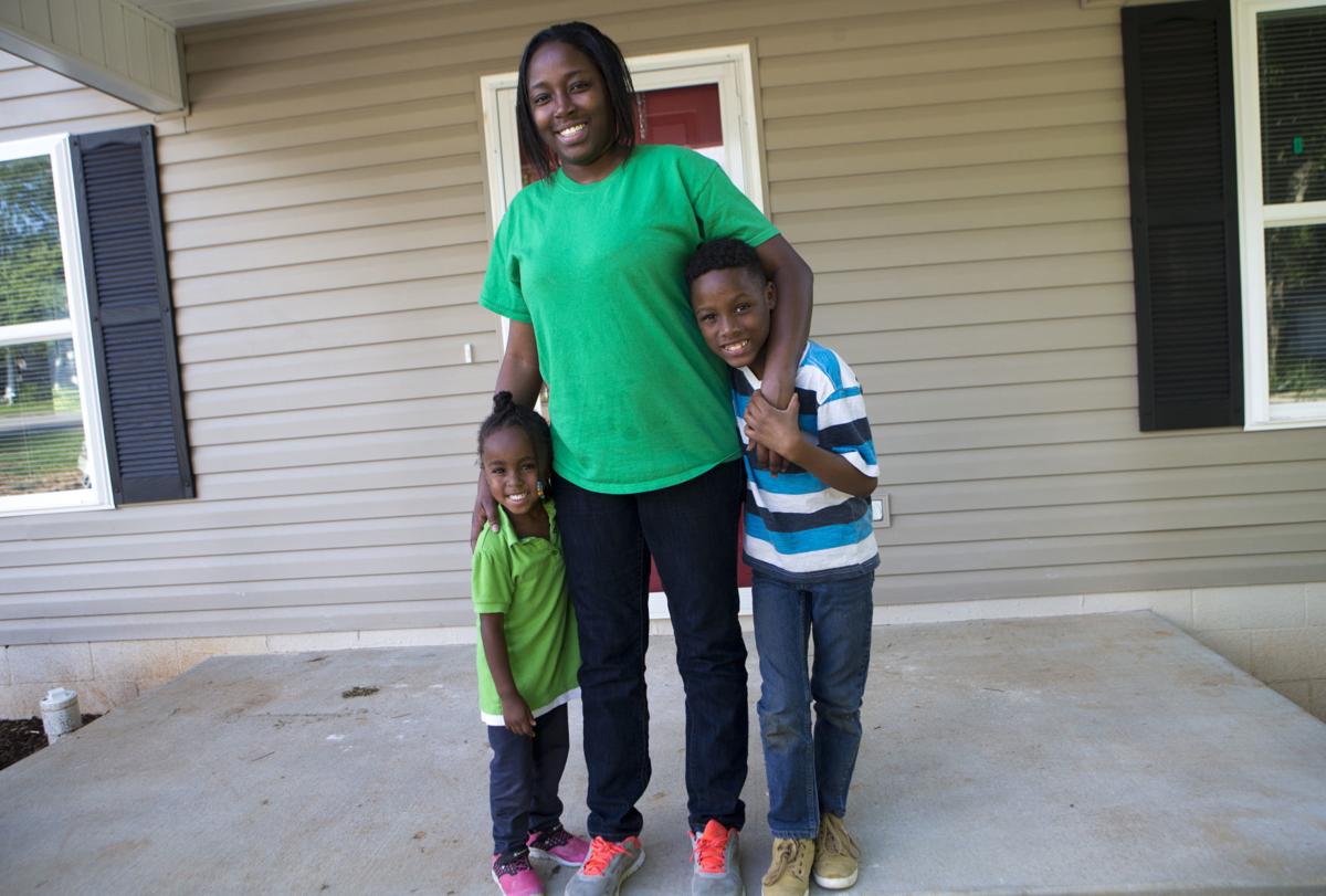 Nikki Griffin and children move into the new home built by Habitat for ...
