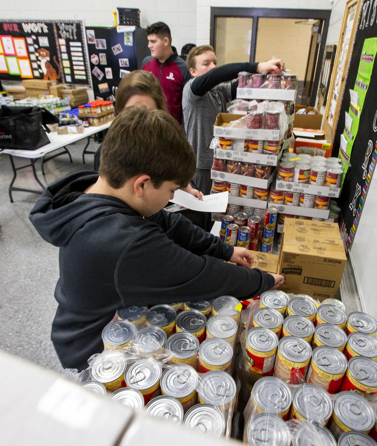 Tigers Feeding Tigers Christmas food distribution at Deshler Middle ...