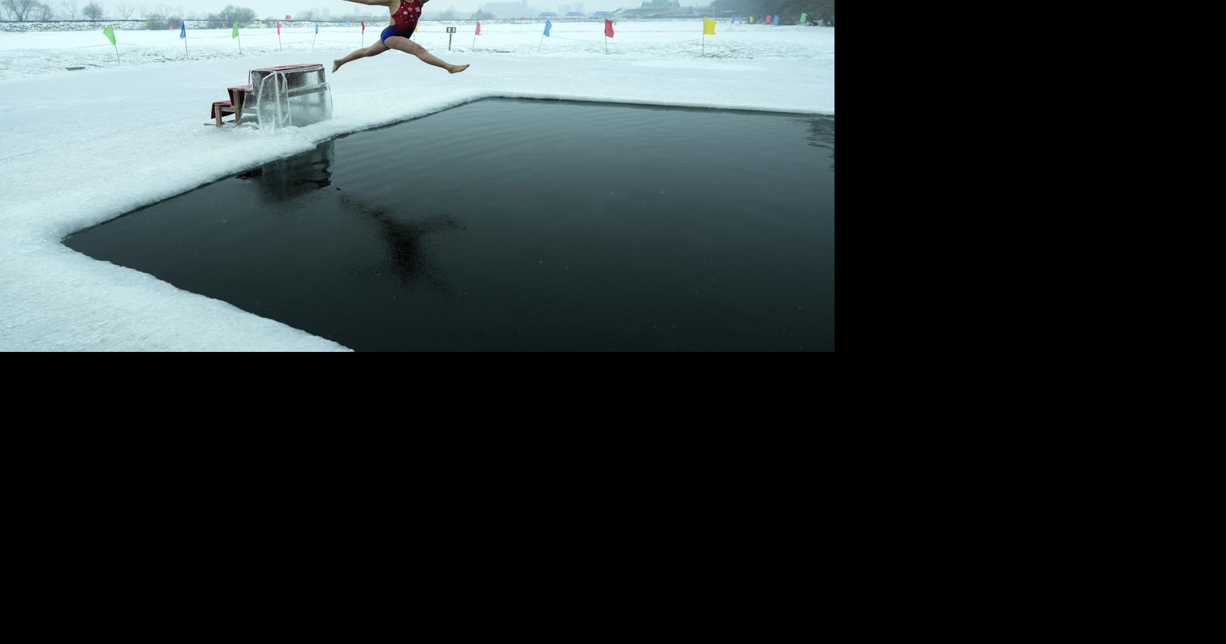 Breaking the ice: In freezing temperatures, swimmers in China plunge ...