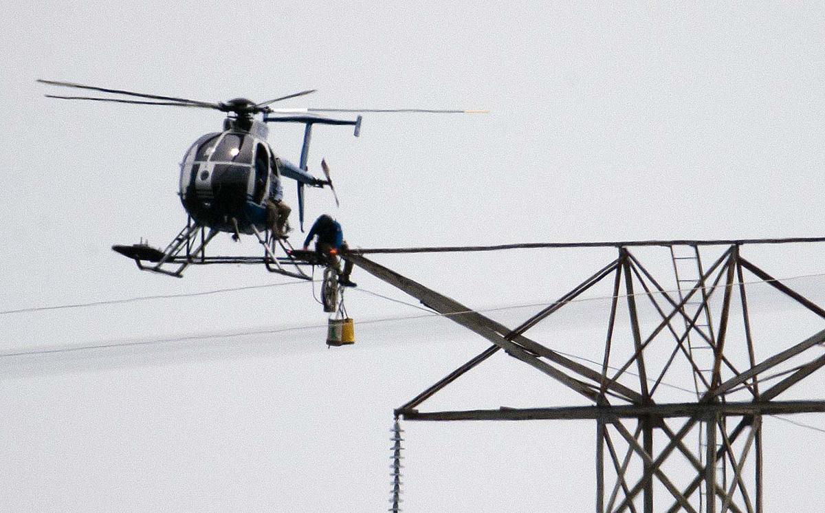 TVA uses helicopters to string powers across the Tennessee River ...