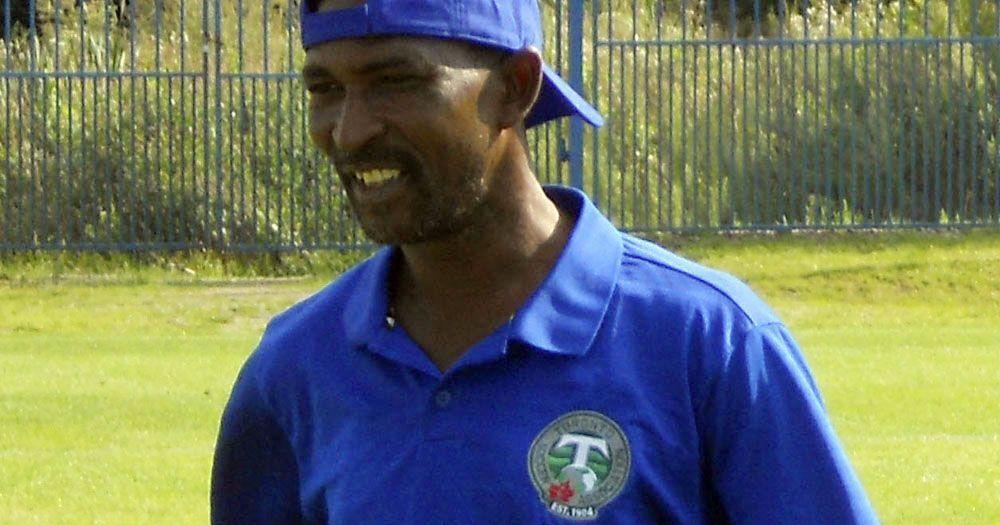 Scarborough coach Patrick (Laza) Lowe helps collect equipment for ...