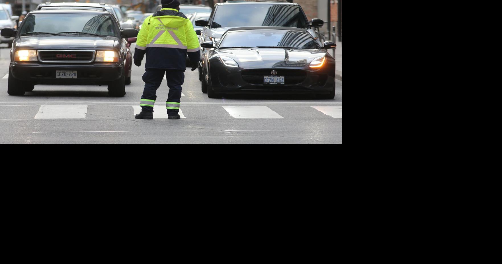 Driver charged after Toronto traffic agent hit ‘multiple times’ at ...