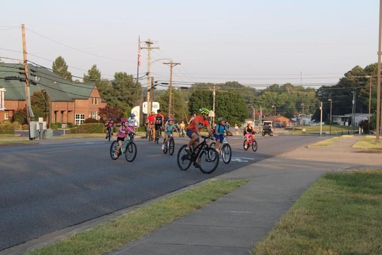 Kids use pedal power to get to school through Calvert City 'Bike Bus ...