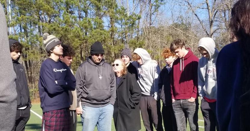 Dozens gather to remember former Woodstock quarterback Robbie Roper ...