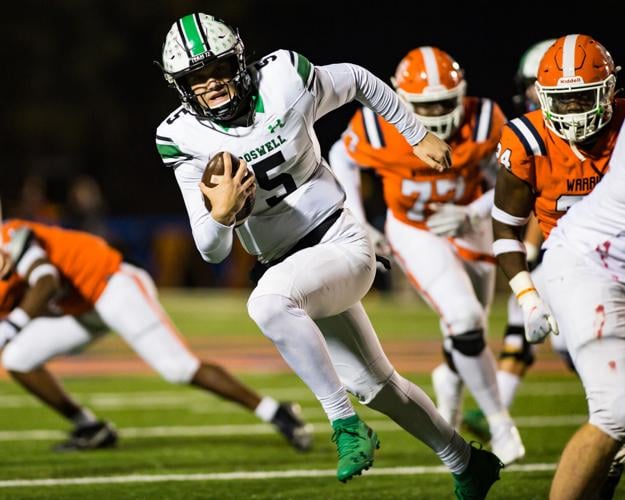 Dozens gather to remember former Woodstock quarterback Robbie Roper ...