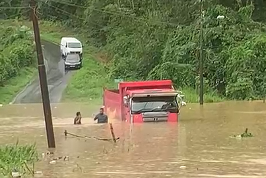 Main road impassable after Caparo River breaches banks | News Extra ...
