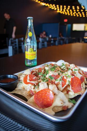 Stacked and loaded at Nacho Business | What's Cooking | tulsapeople.com