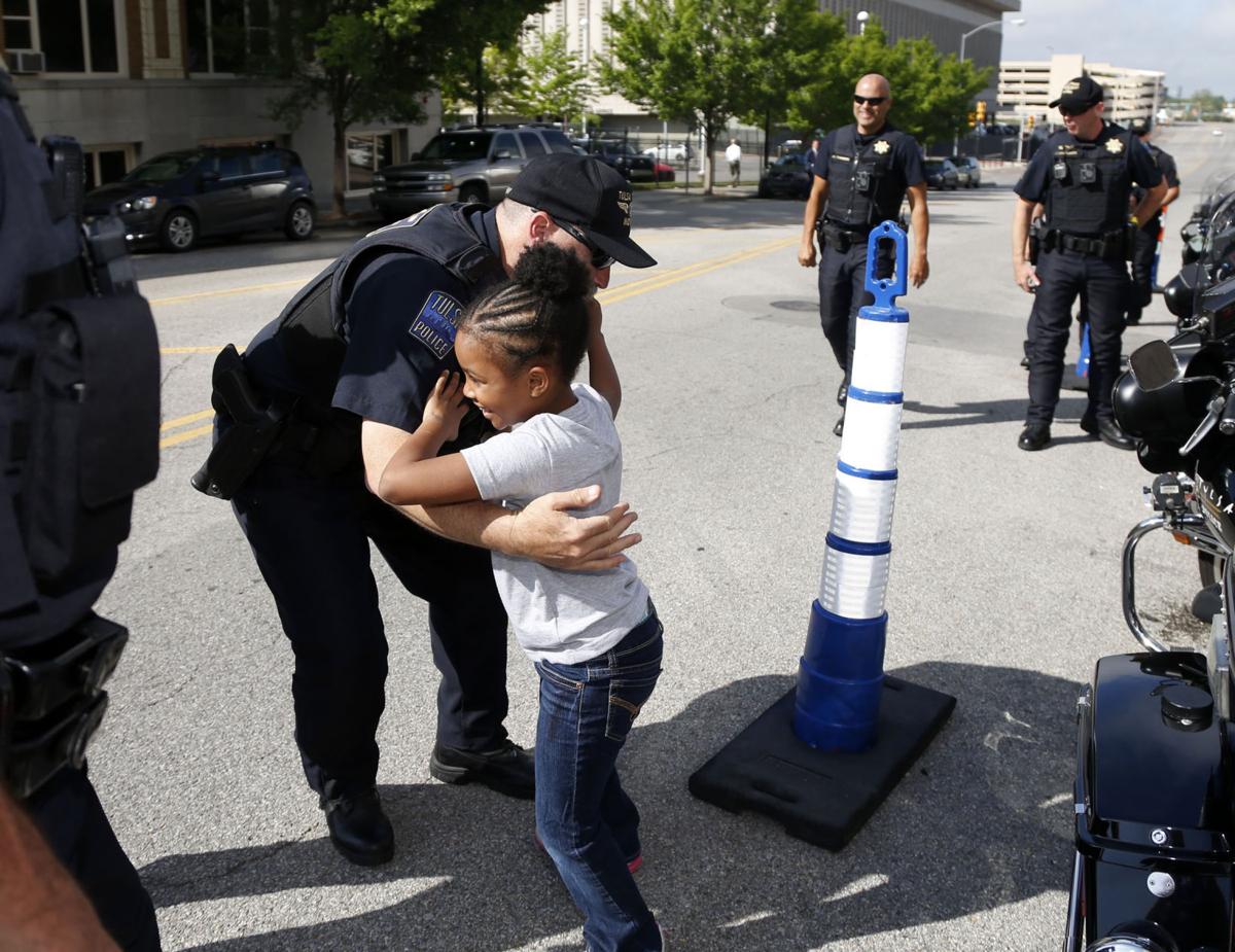 This 7-year-old is on a mission to hug a cop in all 50 states. Her stop ...