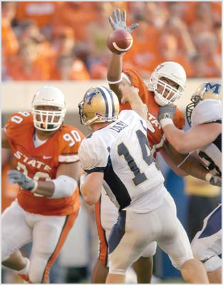 Gundy era begins with modest win