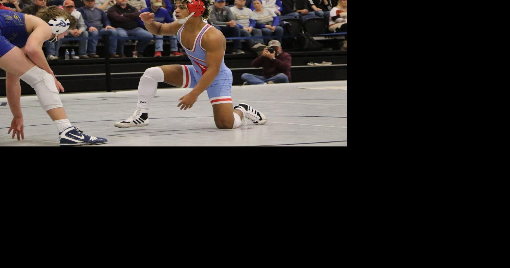 Collinsville's Caleb Tanner tries to keep opponents off-balance on the mat