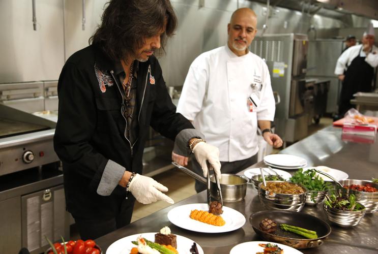 Foreigner singer showcases culinary skills at River Spirit dinner party