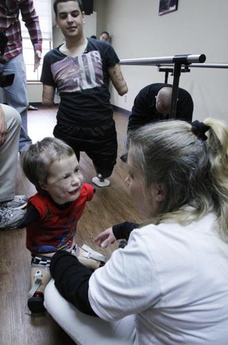 Boy who lost limbs meets fellow quadruple amputee