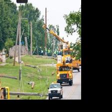 Poles snapped, power lines down