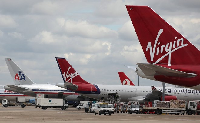 AMR to Seek More Flights Abroad as US Airways Weighs Merger