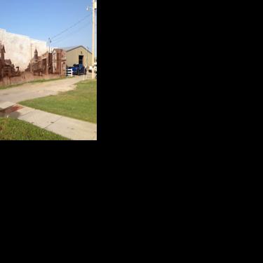 Mural on side of Owasso Historical Museum depicts early 1900s scene