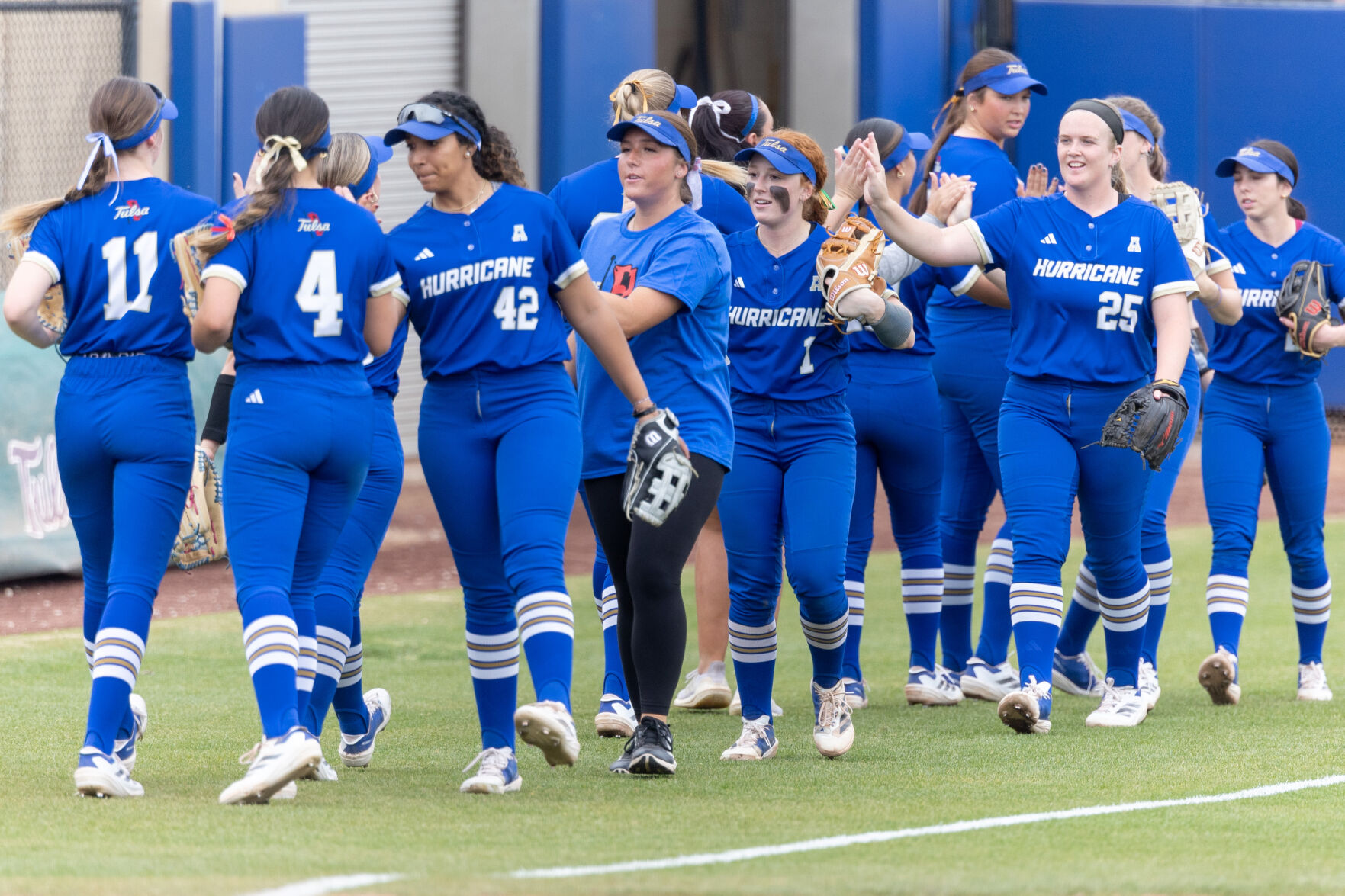 Proud mom has sons in opposite dugouts in OU-Arkansas series