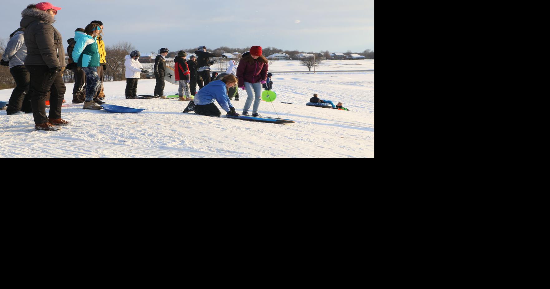 Dozens of sledders take to snowy, steep slopes of Bailey Ranch Golf ...