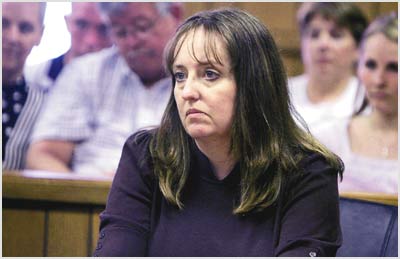 Ex-deputy's wife surrenders on charge