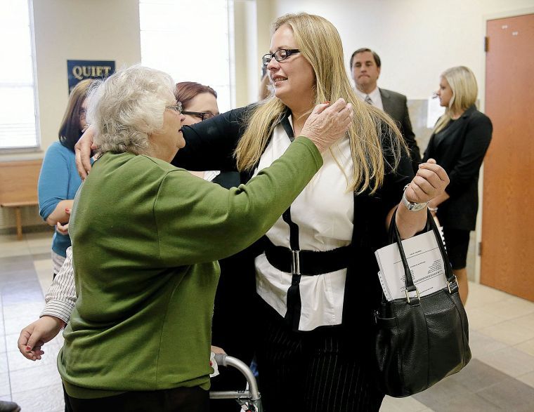 Woman freed after serving 20 years in prison sues city, former district ...