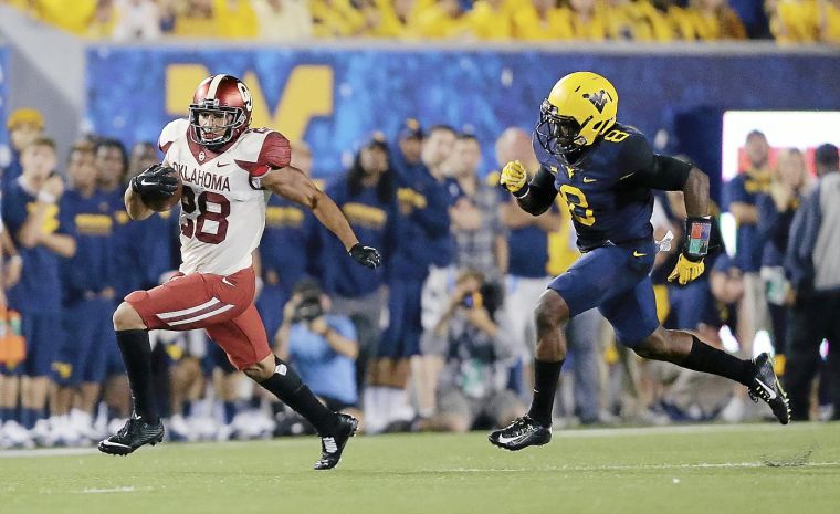 OU running backs rolling up carries without fumbling