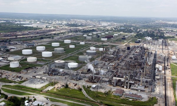 Holly closes refinery deal
