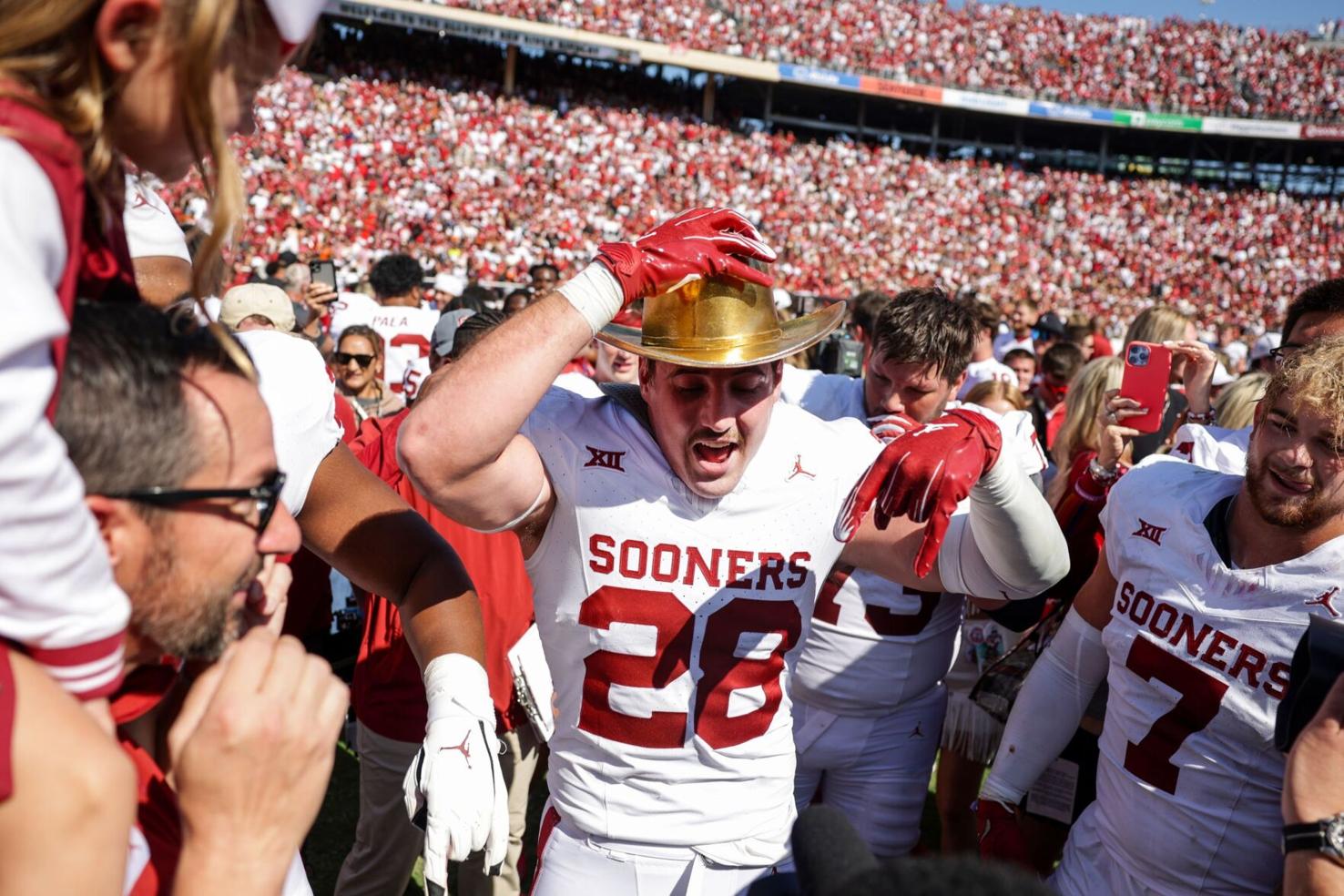Stutsman flaunts ‘Horns Down’ tattoo