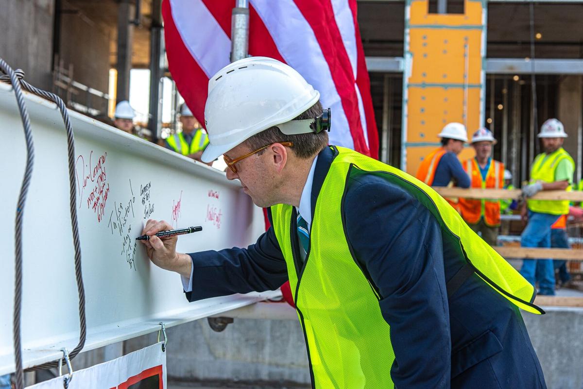 Ceremony held for 11-story building under construction at downtown ...